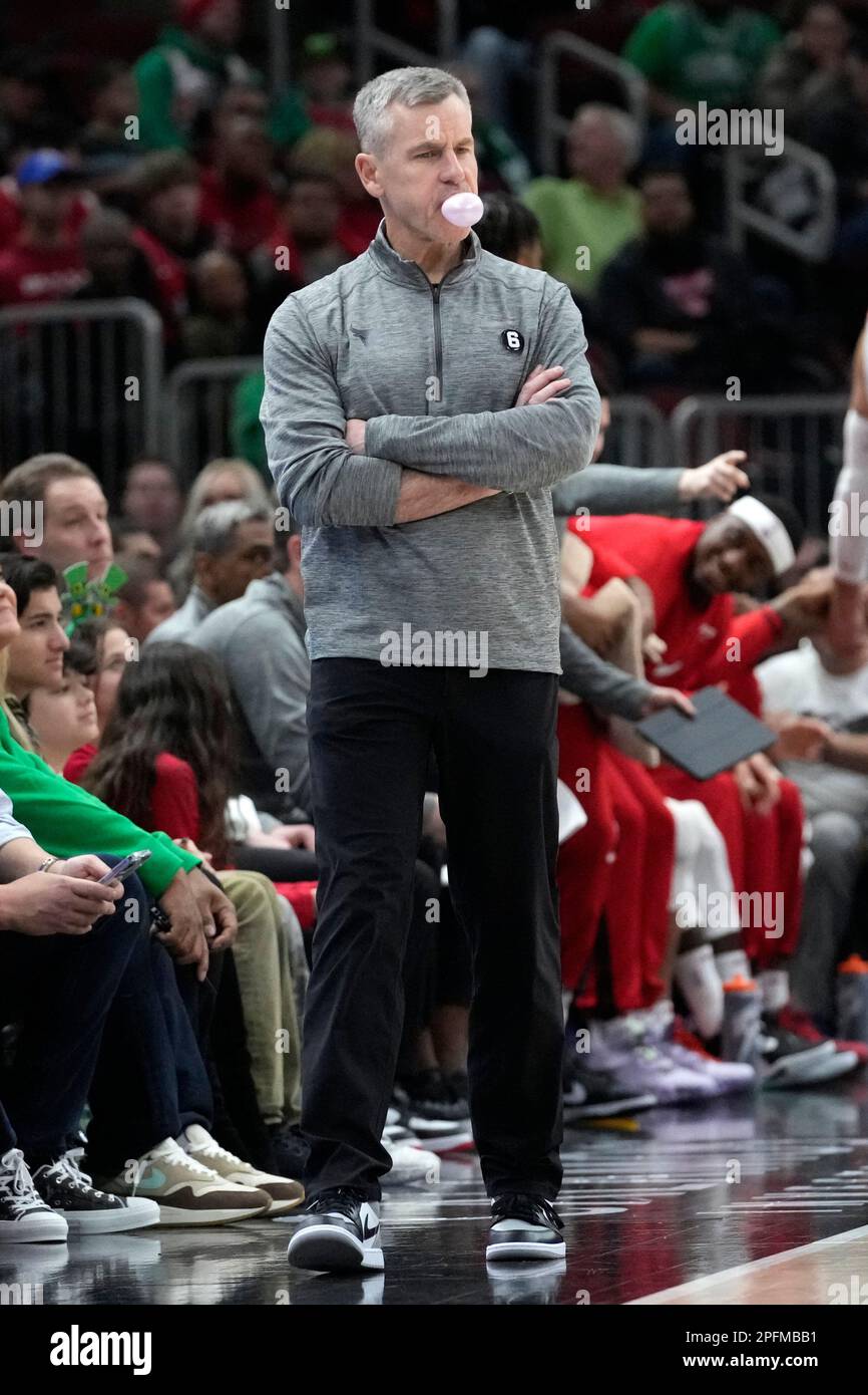 Chicago Bulls coach Billy Donovan blows a bubble as he watches play ...