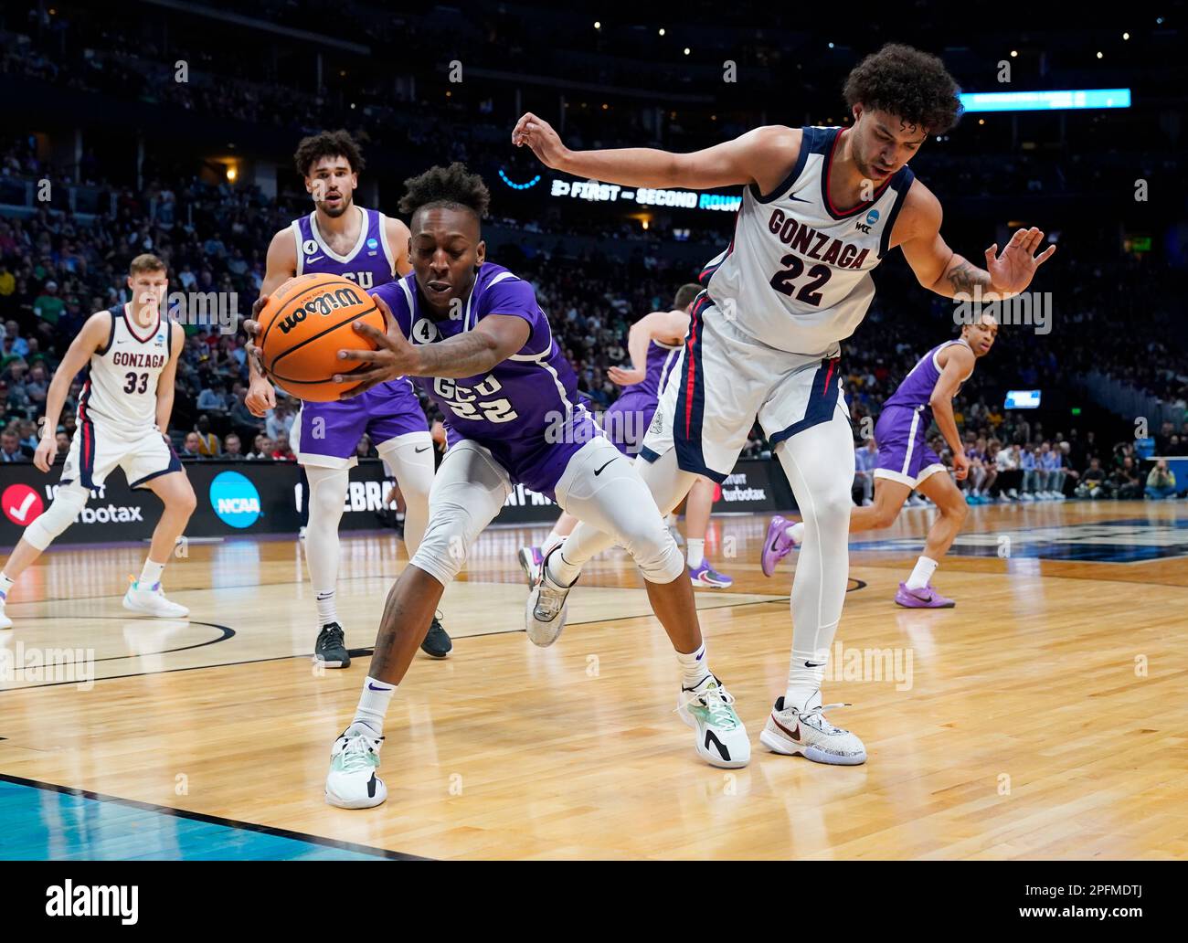 Grand Canyon guard Josh Baker, left, pulls in the ball as Gonzaga ...