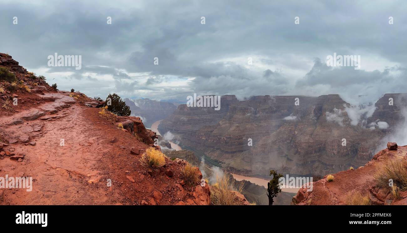 Panorama of Guano Point at the West Rim of the Grand Canyon on a cool rainy foggy day with ...