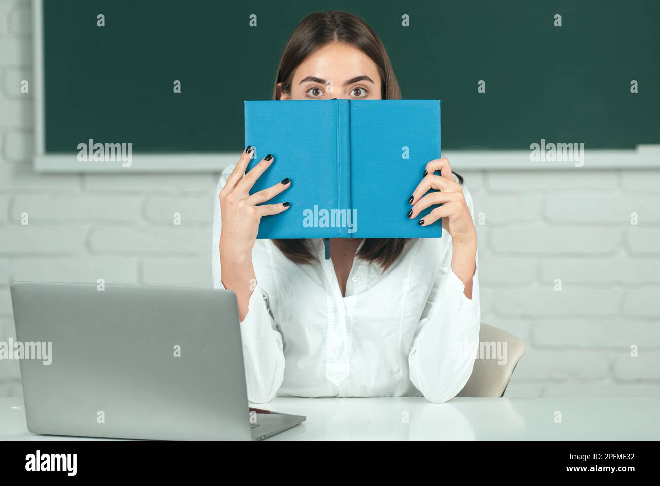 Beautiful student, cute young woman in class at school. Female college ...