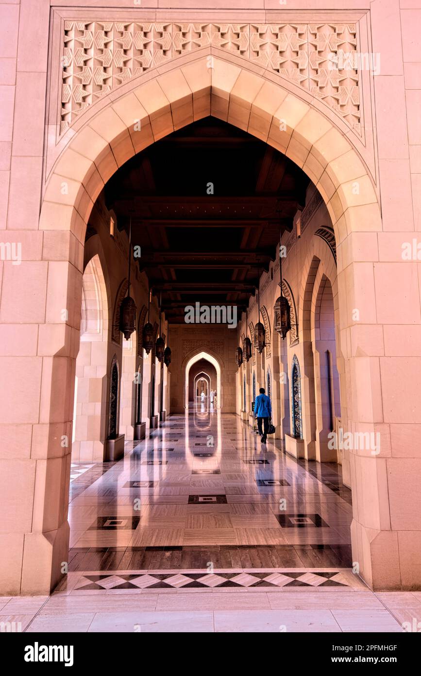 Looking through an arch at the Sultan Qaboos Grand Mosque, Muscat, Oman ...