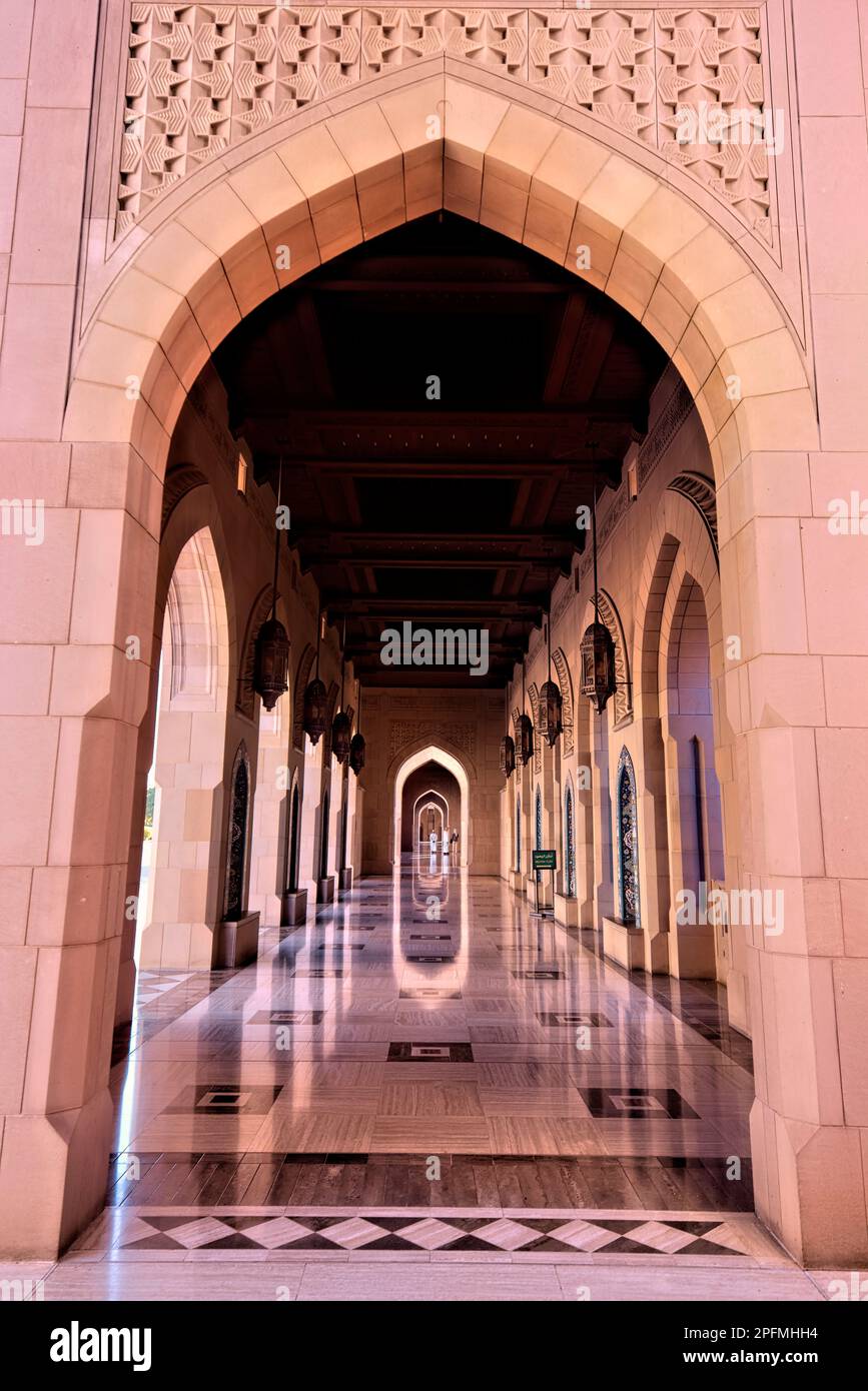 Looking through an arch at the Sultan Qaboos Grand Mosque, Muscat, Oman ...
