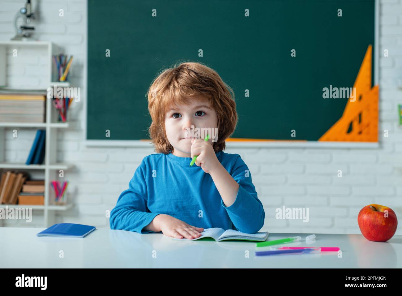 Little child at school lesson. Kids gets ready for school. Cute ...