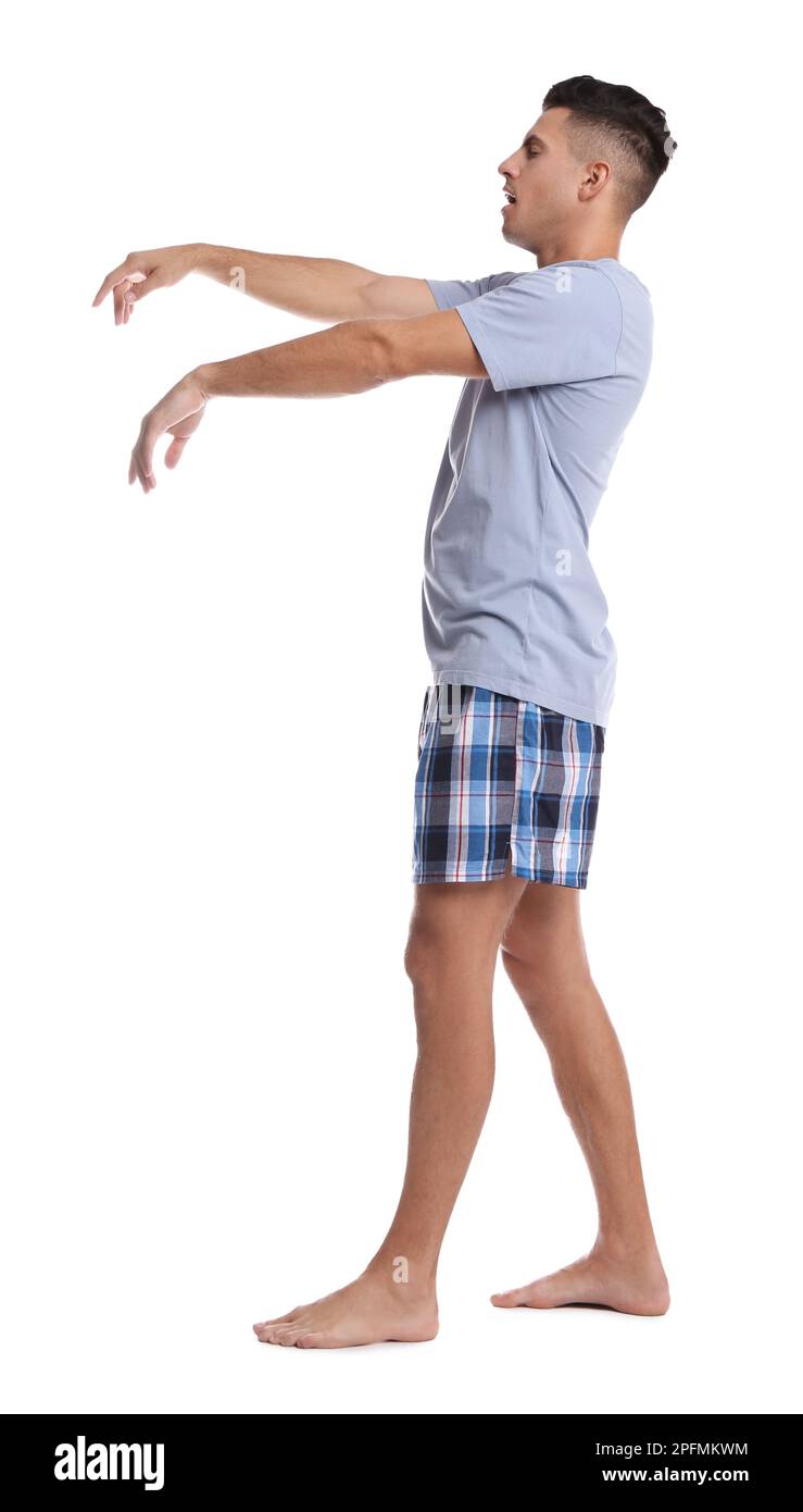 Somnambulist in pajamas on white background. Sleepwalking Stock Photo ...