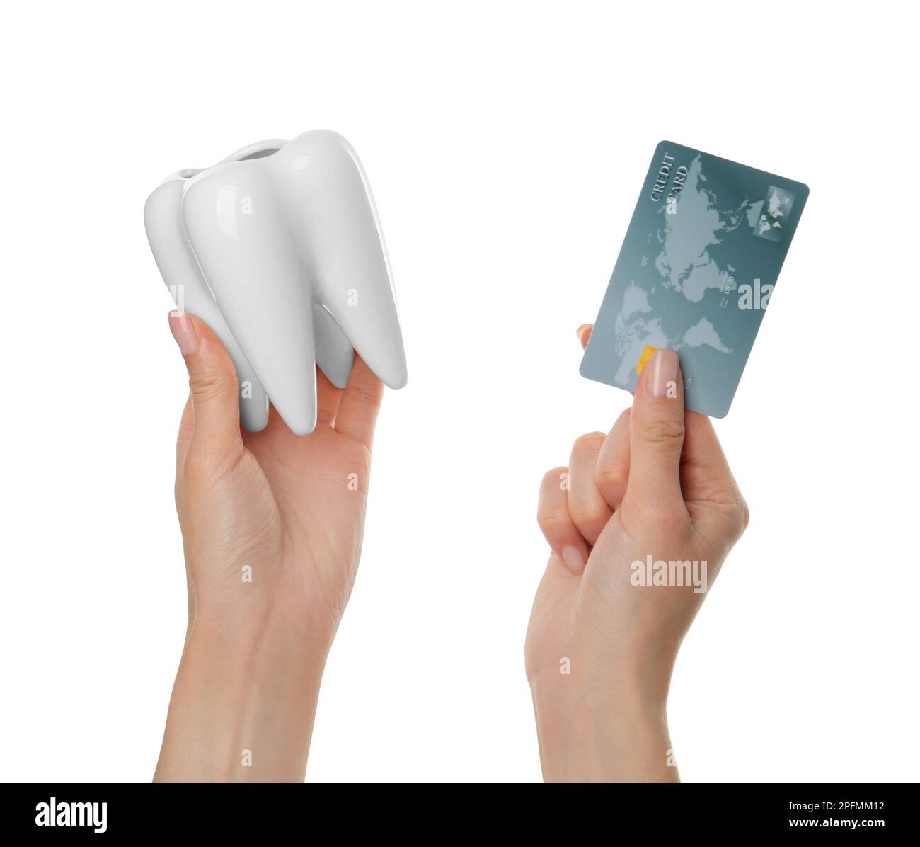 Woman holding ceramic model of tooth and credit card on white ...