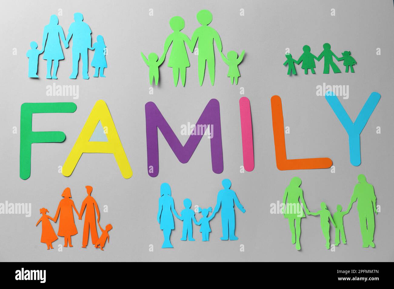 Paper cutouts and word Family made of colorful letters on grey ...