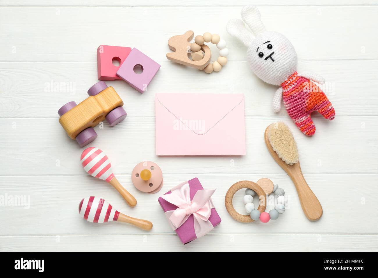 Baby shower party. Envelope surrounded by gift box and stuff for child ...