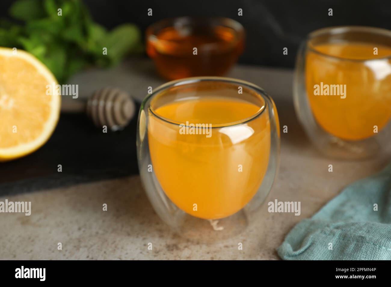 Immunity boosting drink and ingredients on light grey table Stock Photo ...