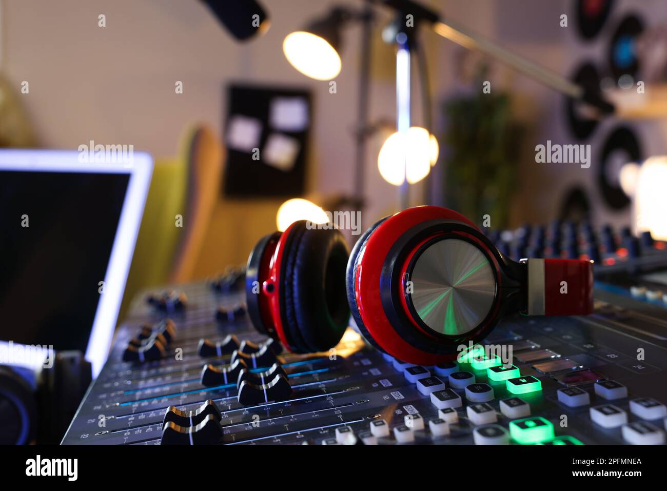 Headphones on professional mixing console in radio studio Stock Photo ...