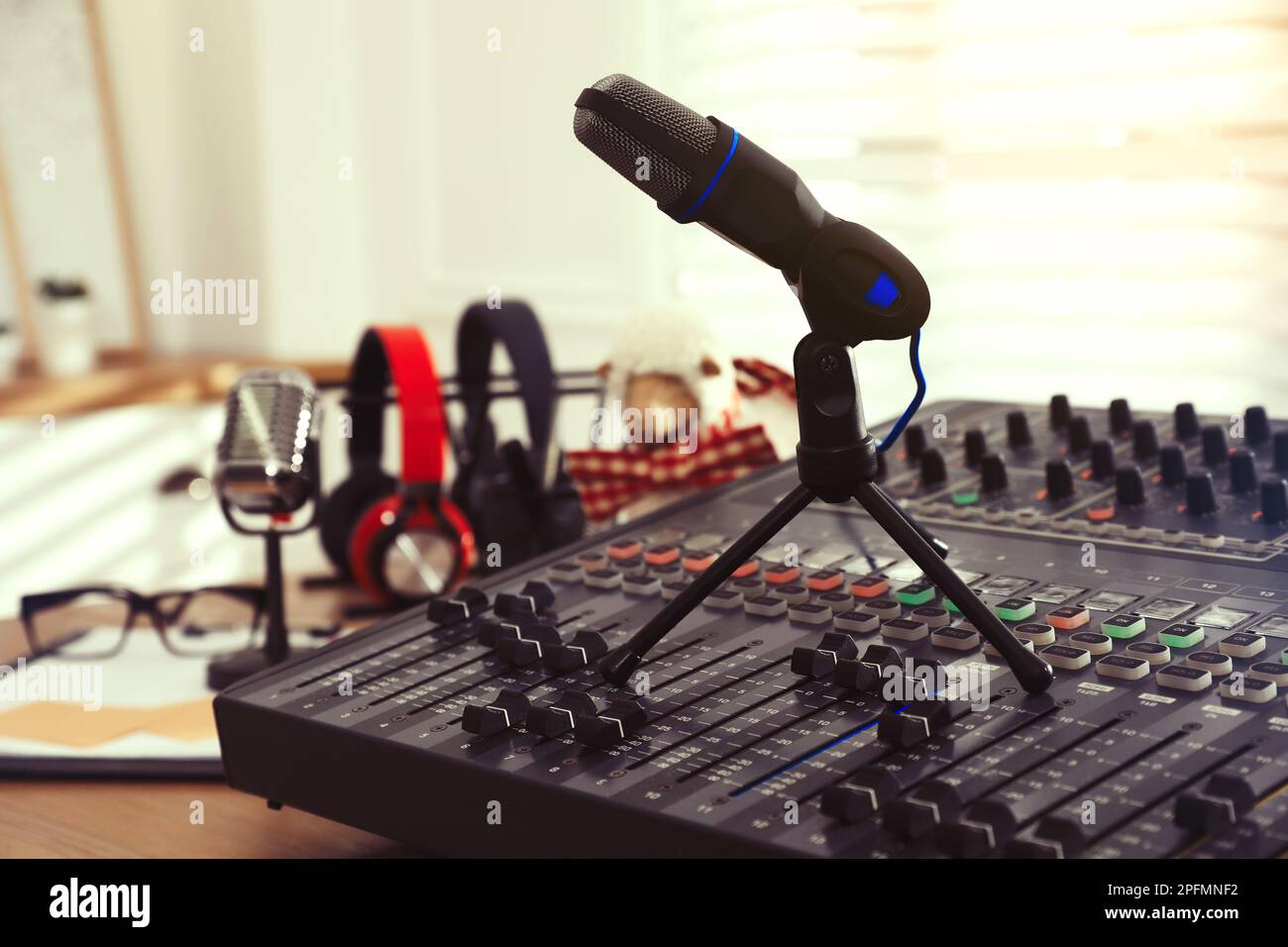 Microphone and professional mixing console in radio studio Stock Photo ...