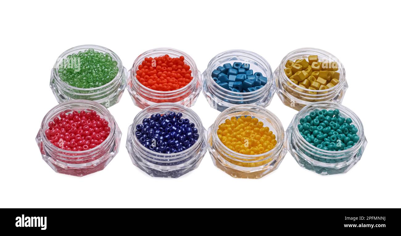Plastic containers with different beads on white background Stock Photo ...