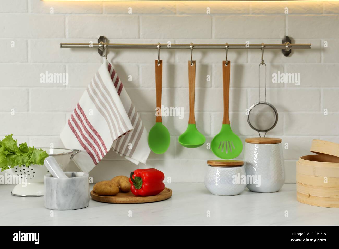 Countertop with different cooking utensils and products in kitchen ...