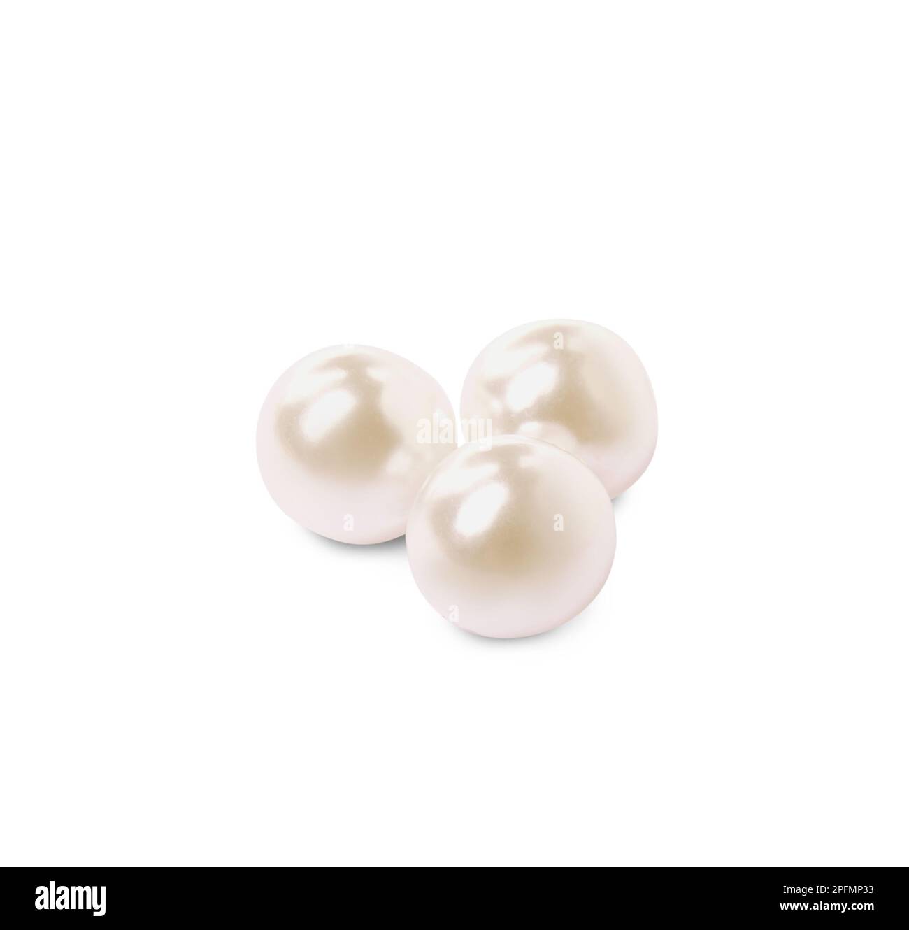 Three beautiful oyster pearls on white background Stock Photo - Alamy