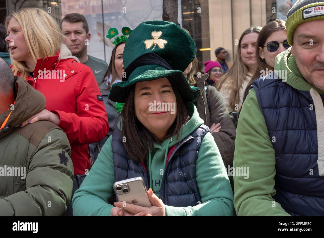 NEW YORK, NEW YORK - MARCH 17: Spectators watch and cheer during the St ...