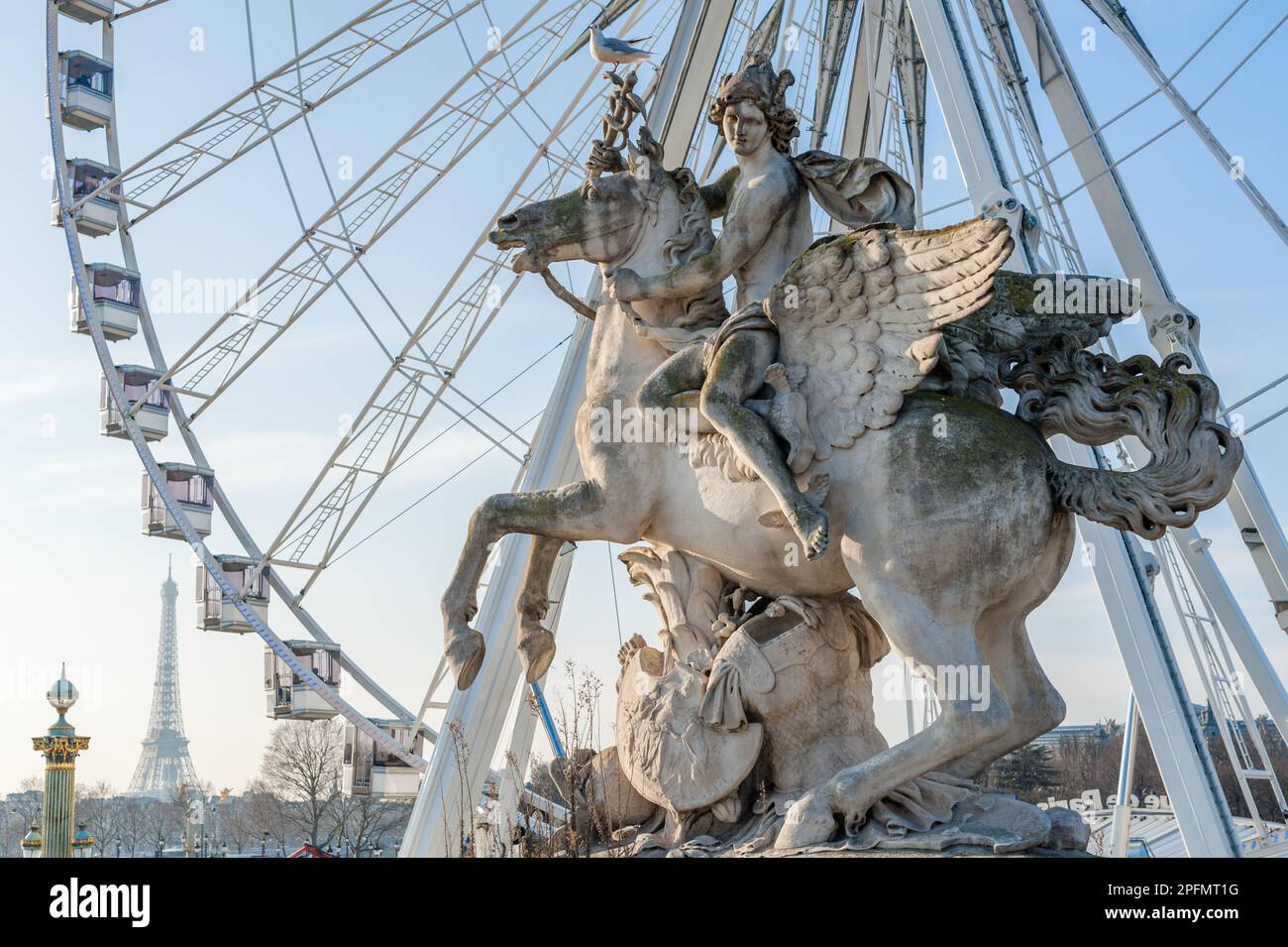 Perseus on Pegasus statue and Ferris wheel against blue sky Stock Photo ...