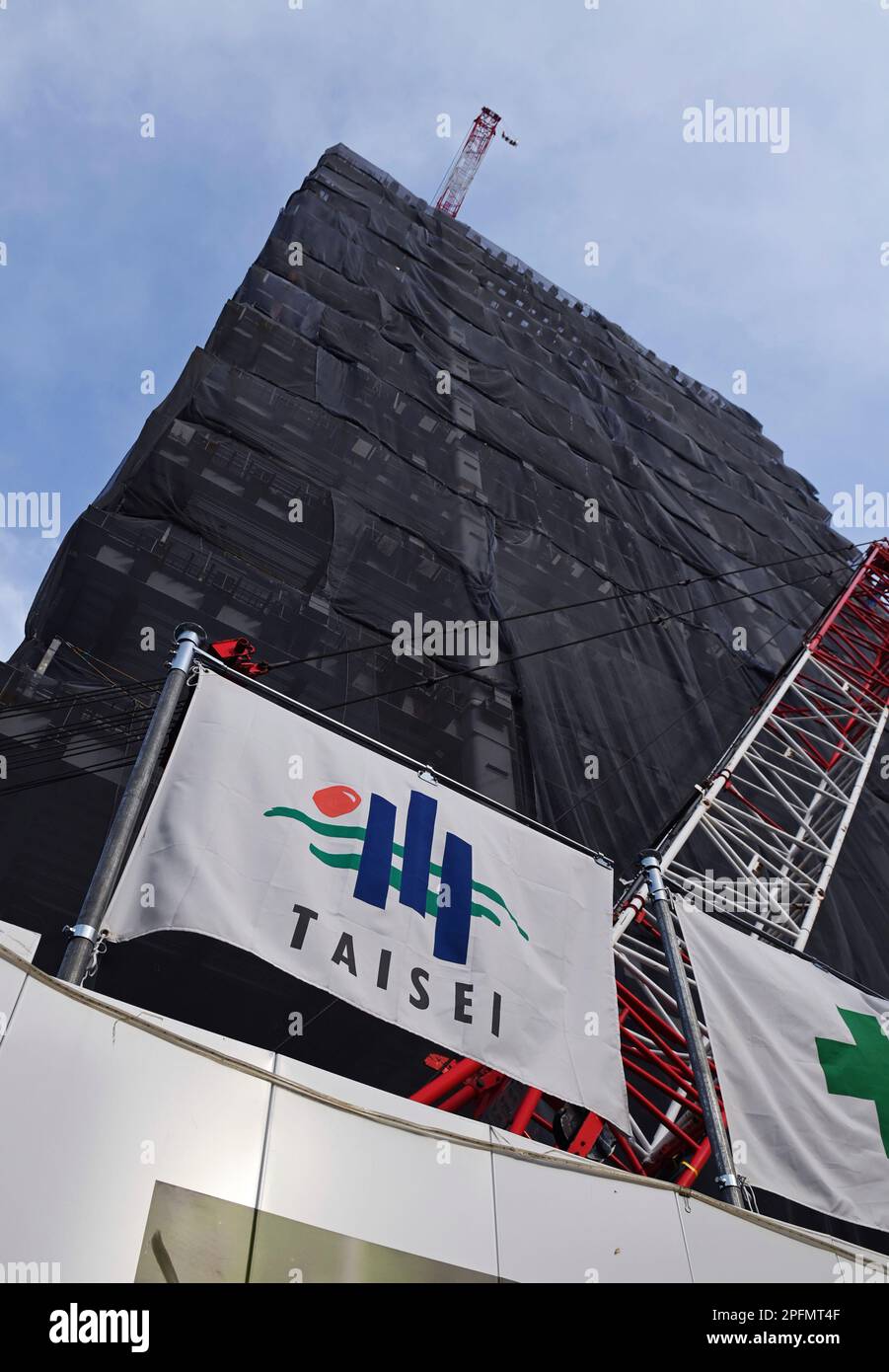 A photo shows a high-rise complex building under construction, where it ...