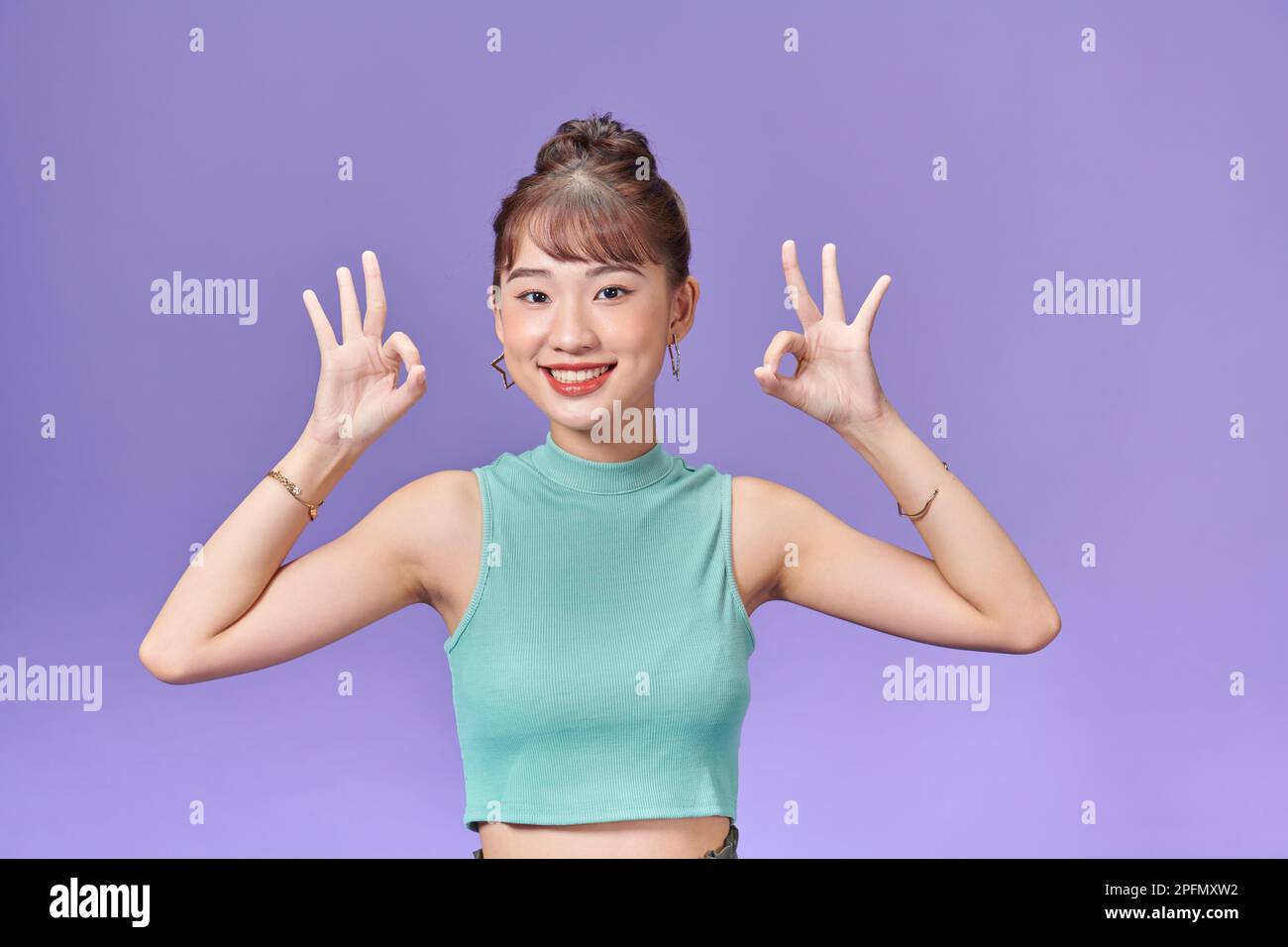 Portrait happy Asian woman shows ok sign looking at camera Stock Photo - Alamy