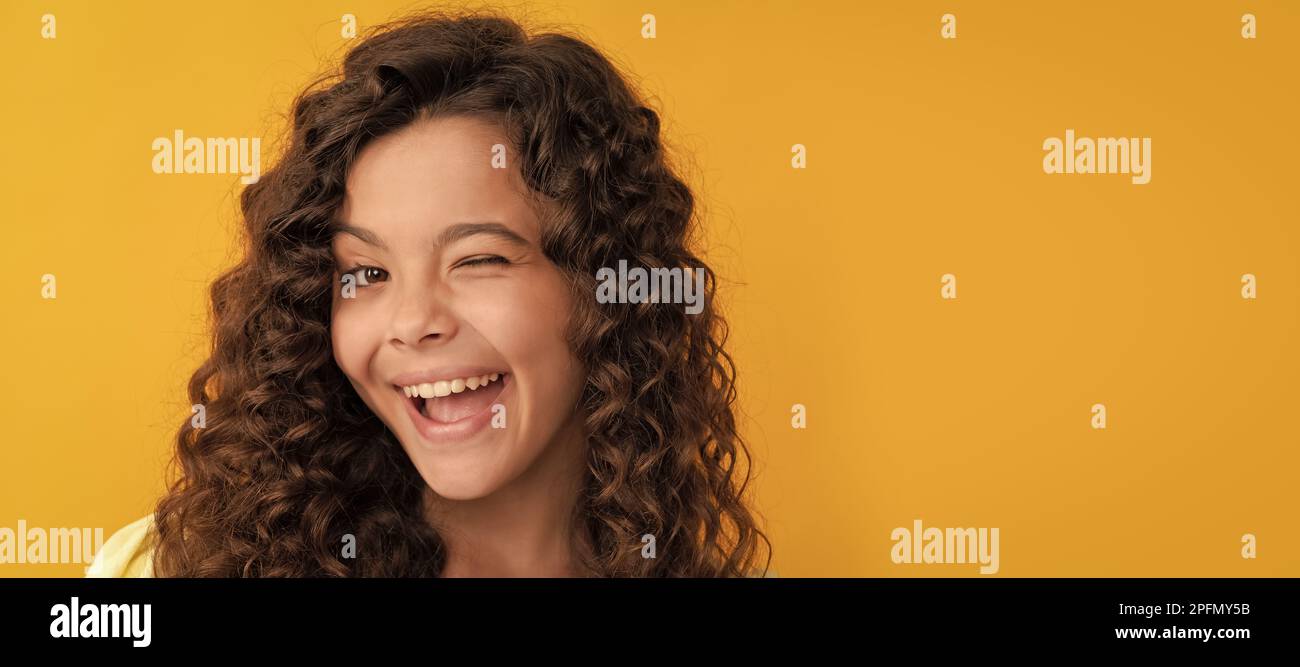 happy winking teen girl with long curly hair and perfect skin, frizzy ...