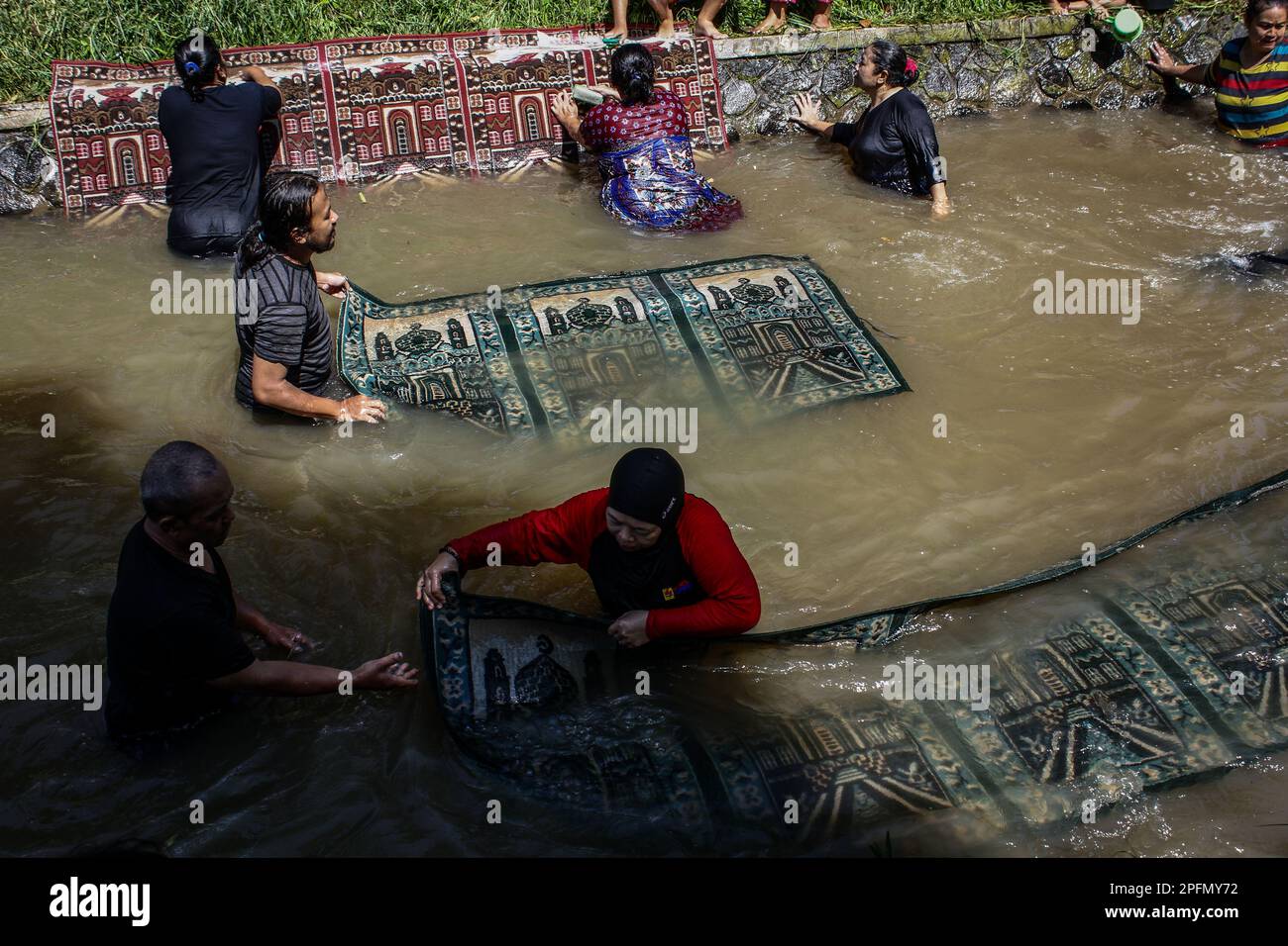 Bandung, West Java, Indonesia. 18th Mar, 2023. Residents washing mosque carpets or prayer mats ...