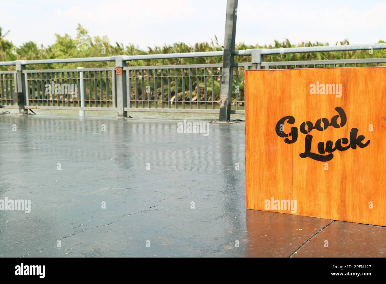 Wooden Bench with the Word Good Luck on the Riverside Promenade Stock ...
