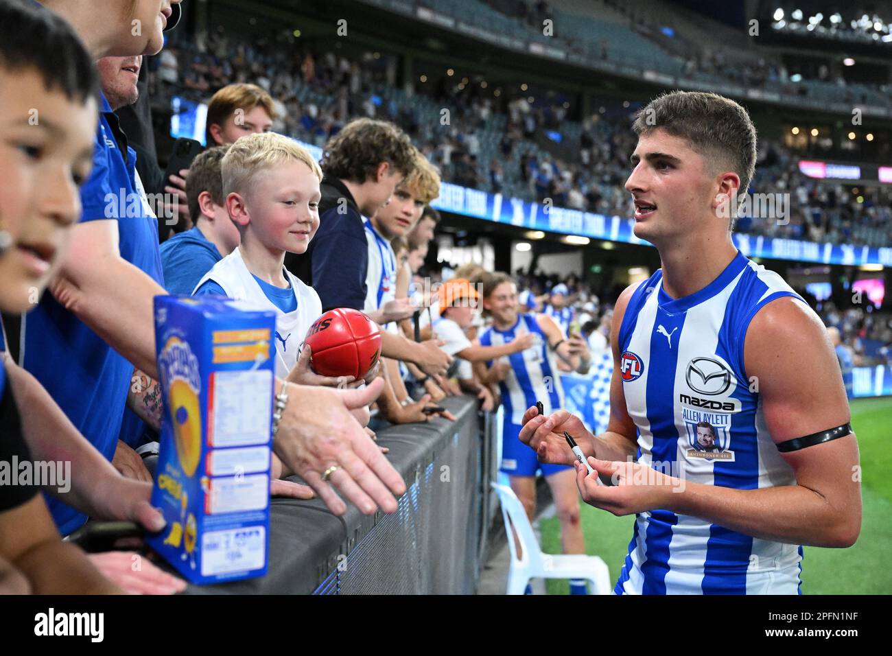 Harry Sheezel of North Melbourne is seen with fans after defeating the ...