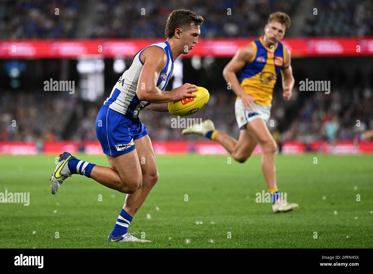 Will Phillips of North Melbourne (left) in action during the AFL Round ...