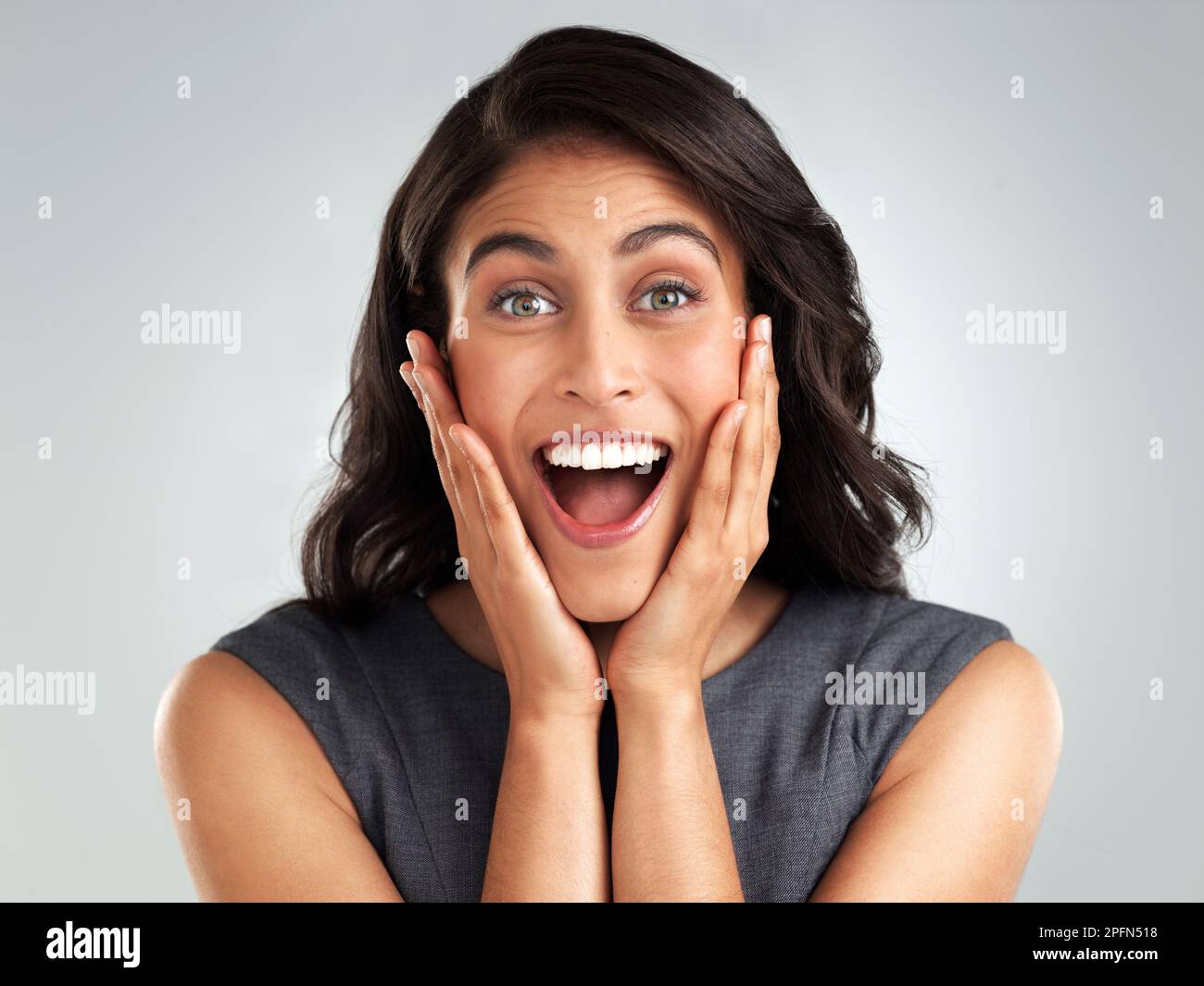 I cant wait to share the good news. a young woman looking surprised ...