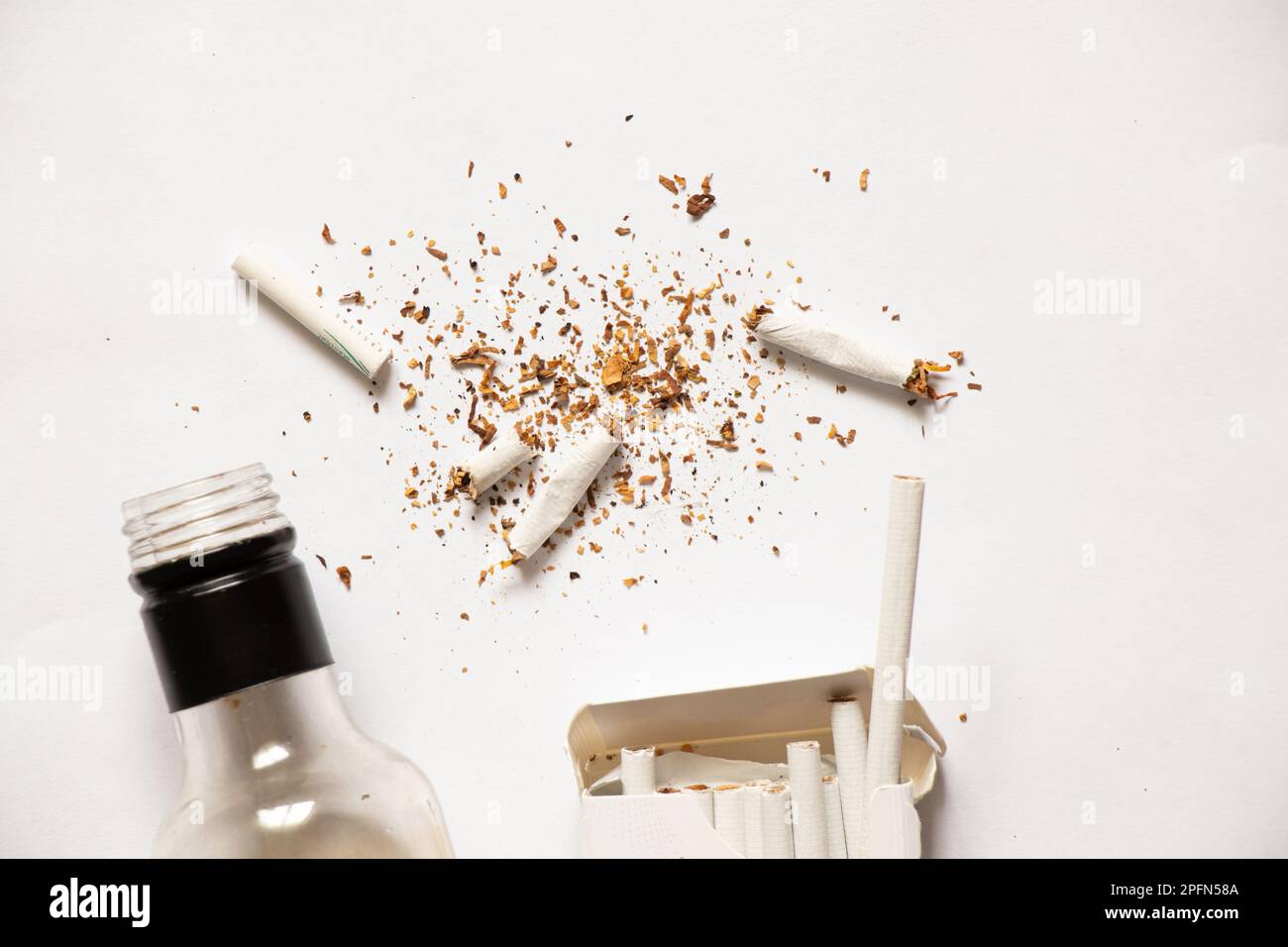 cigarettes and alcoholic beverages on an isolated background close-up ...