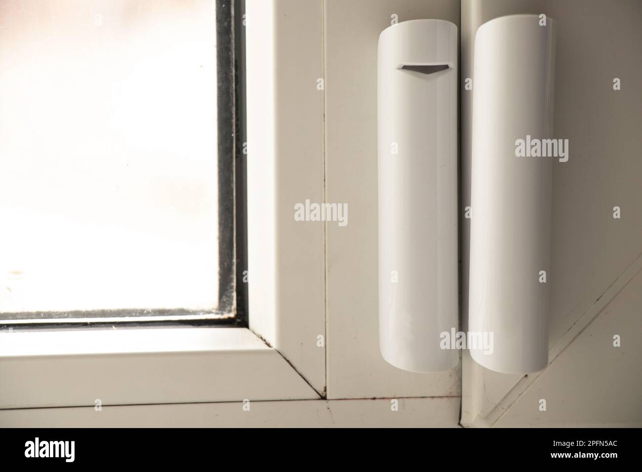 window opening sensor hanging on the window, home alarm system, home ...