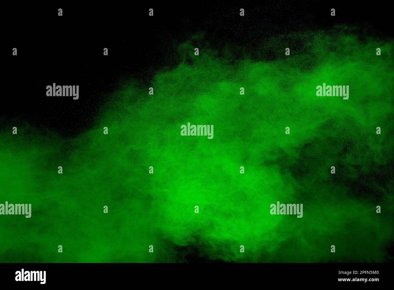 Abstract green powder explosion on black background.Freeze motion of ...