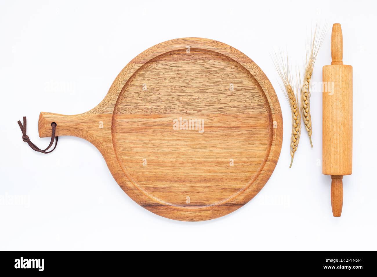 Empty wooden pizza platter set up on isolated on white background ...
