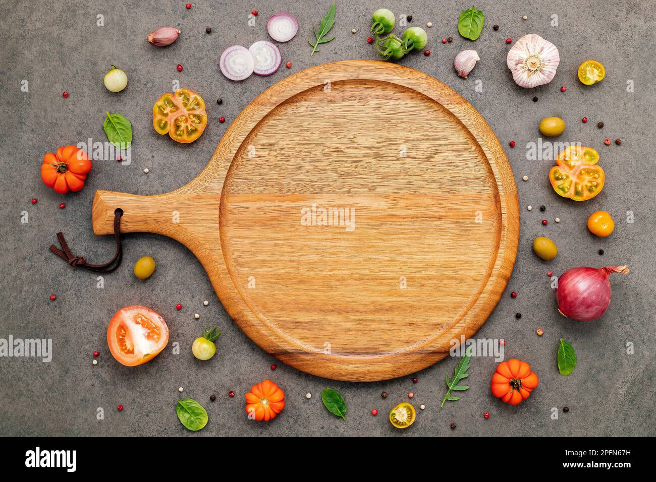 The ingredients for homemade pizza set up on white concrete background ...