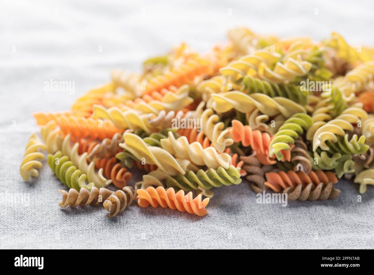 A variety of fusilli pasta made from different types of legumes, green ...