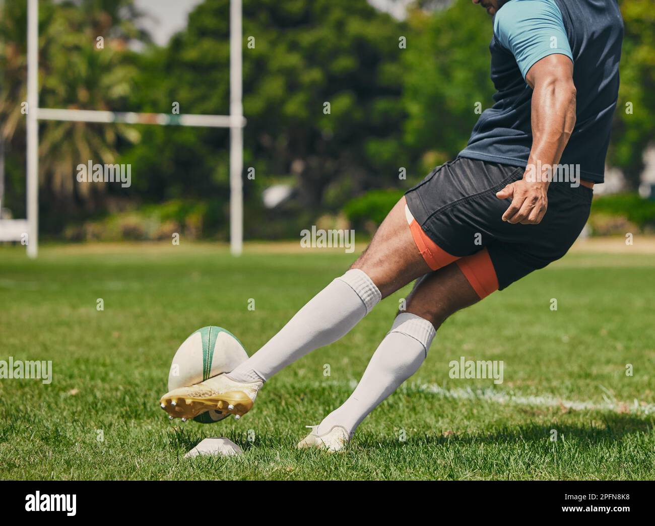 Rugby, sports man or kickball in game, practice workout or training ...