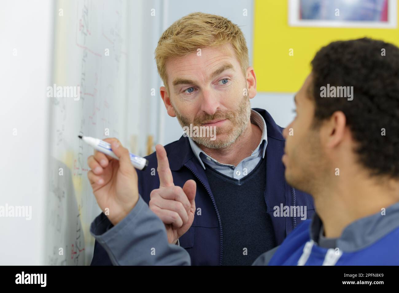 enginer writing on white board Stock Photo - Alamy