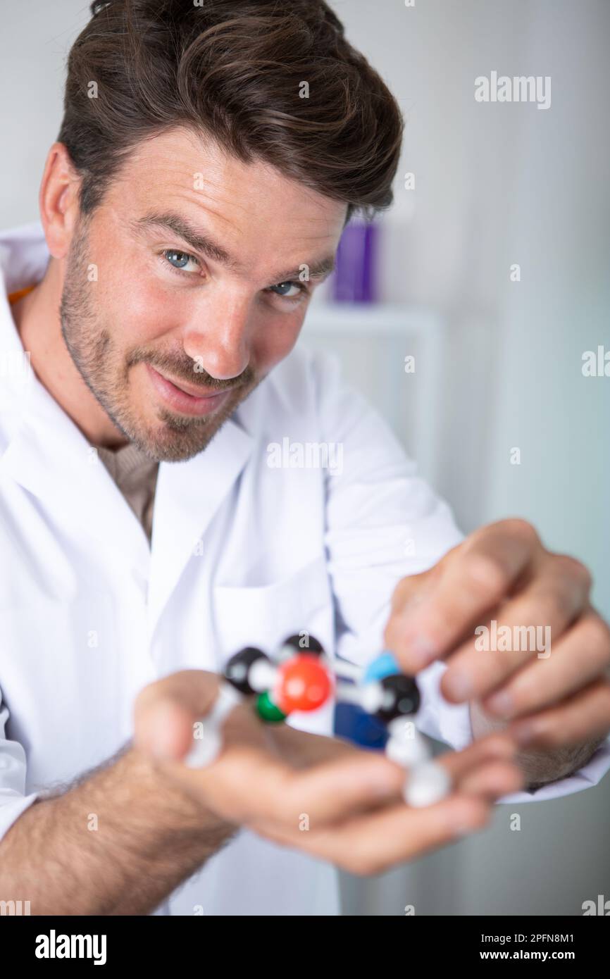 close-up of laboratory worker viewing a dna model Stock Photo - Alamy
