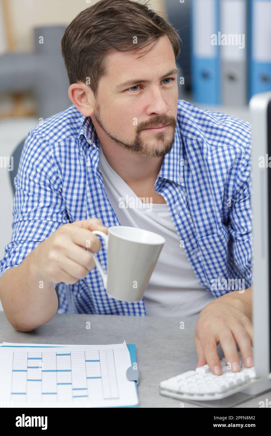 man typing on computer keyboard Stock Photo - Alamy