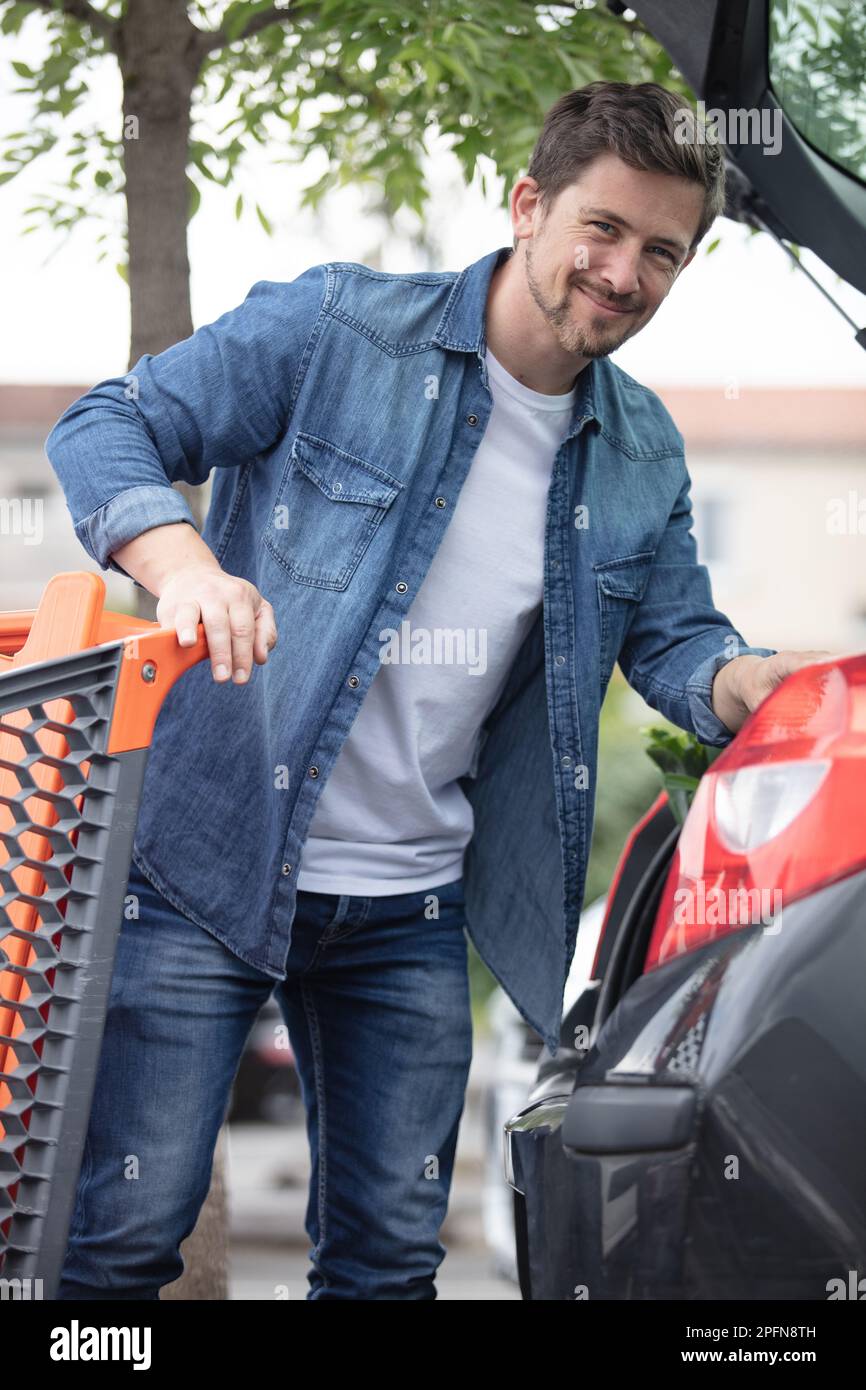 happy stylish man with loading car Stock Photo - Alamy