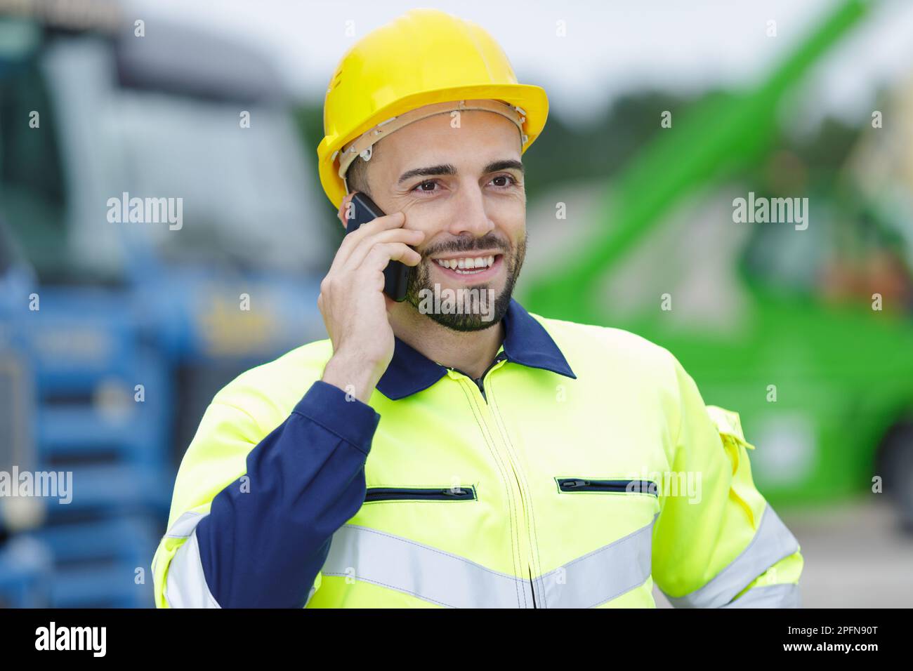 construction worker having conversation on phone Stock Photo - Alamy