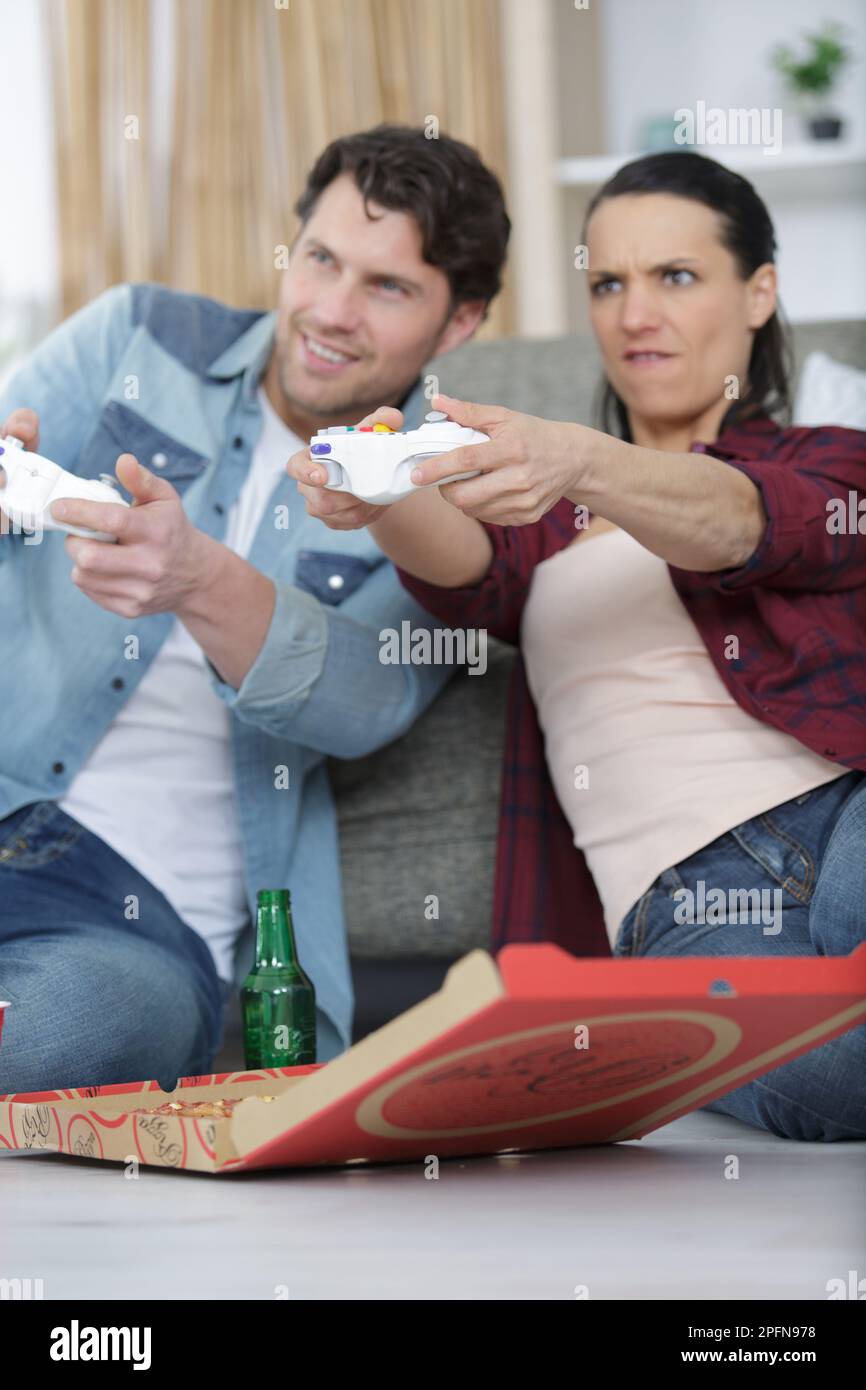 competitive couple playing a computer game Stock Photo - Alamy