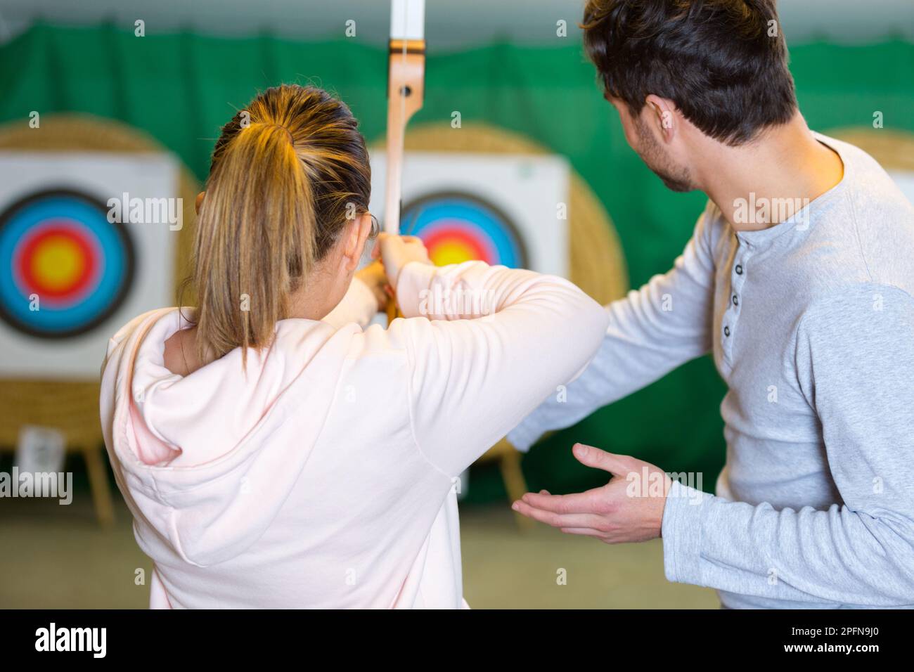 archery target with embedded arrows Stock Photo - Alamy