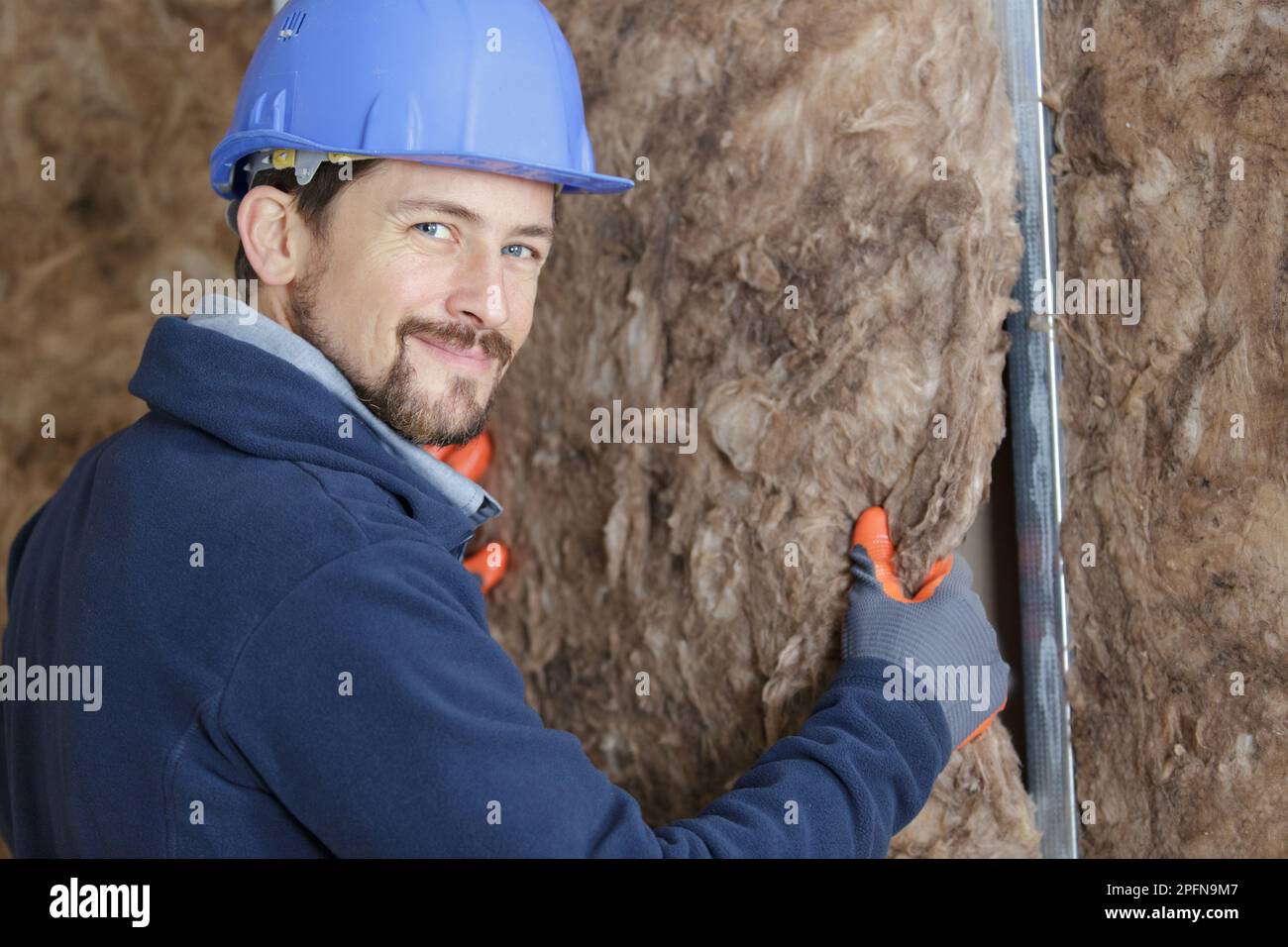 male worker during insulation installation Stock Photo - Alamy
