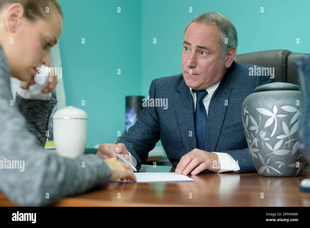 talking with customer about death services Stock Photo - Alamy
