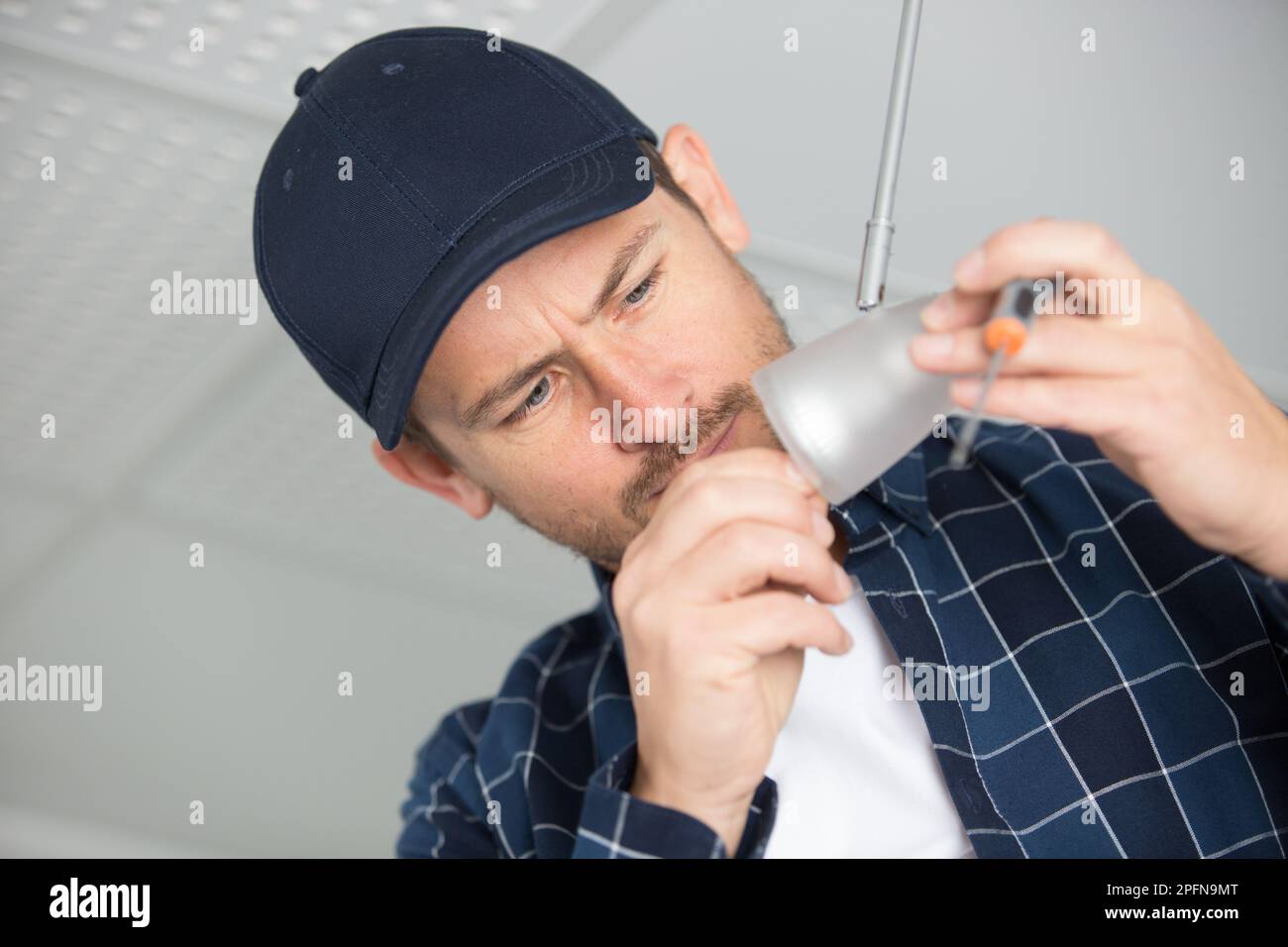 Young worker man installing led hi-res stock photography and images - Alamy