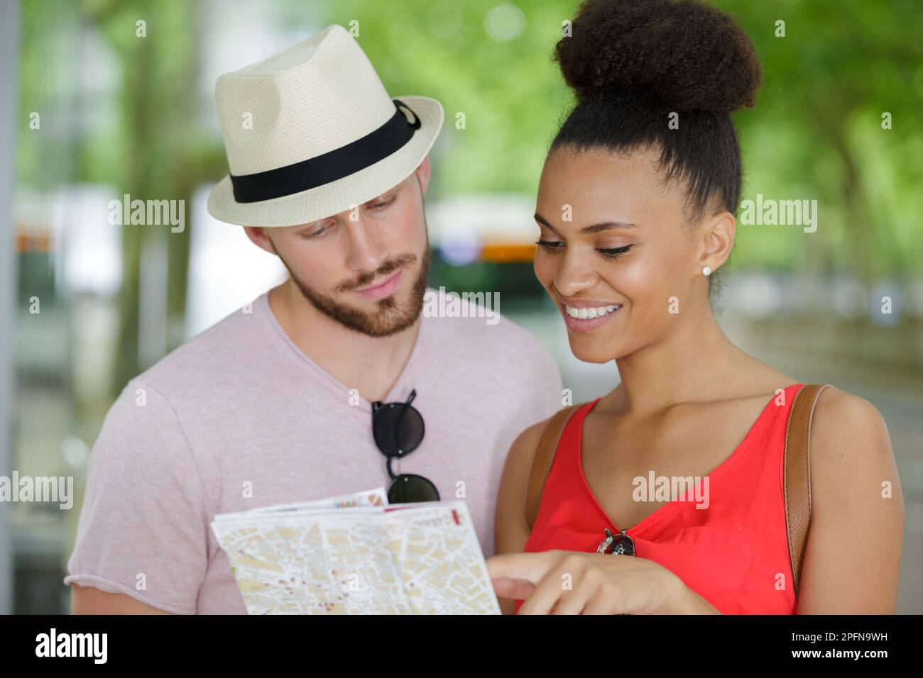 couple of tourists searching an interesting place on the map Stock ...