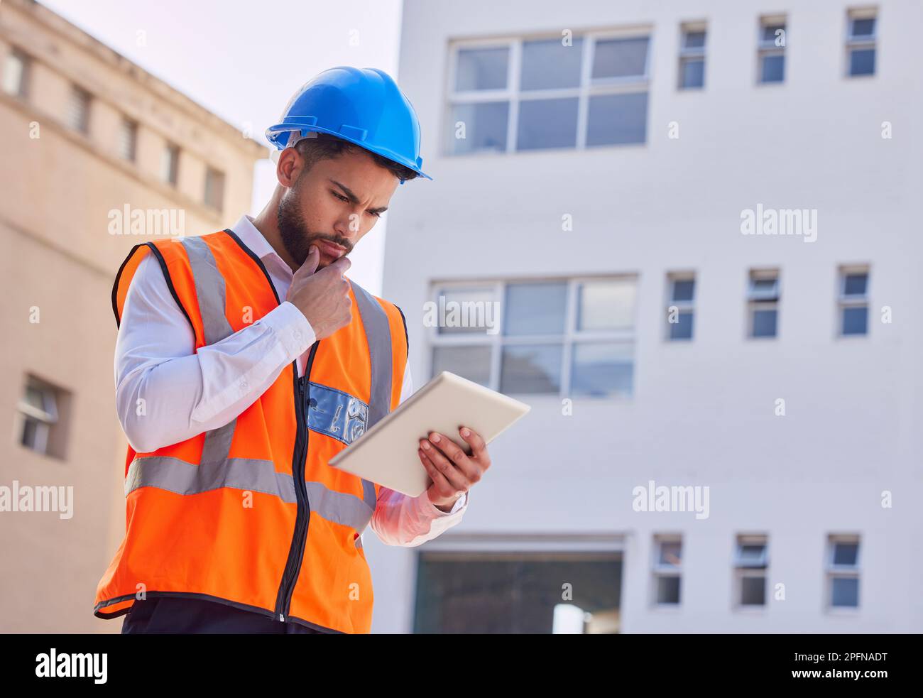 Tablet, thinking and engineering man, construction worker or building ...