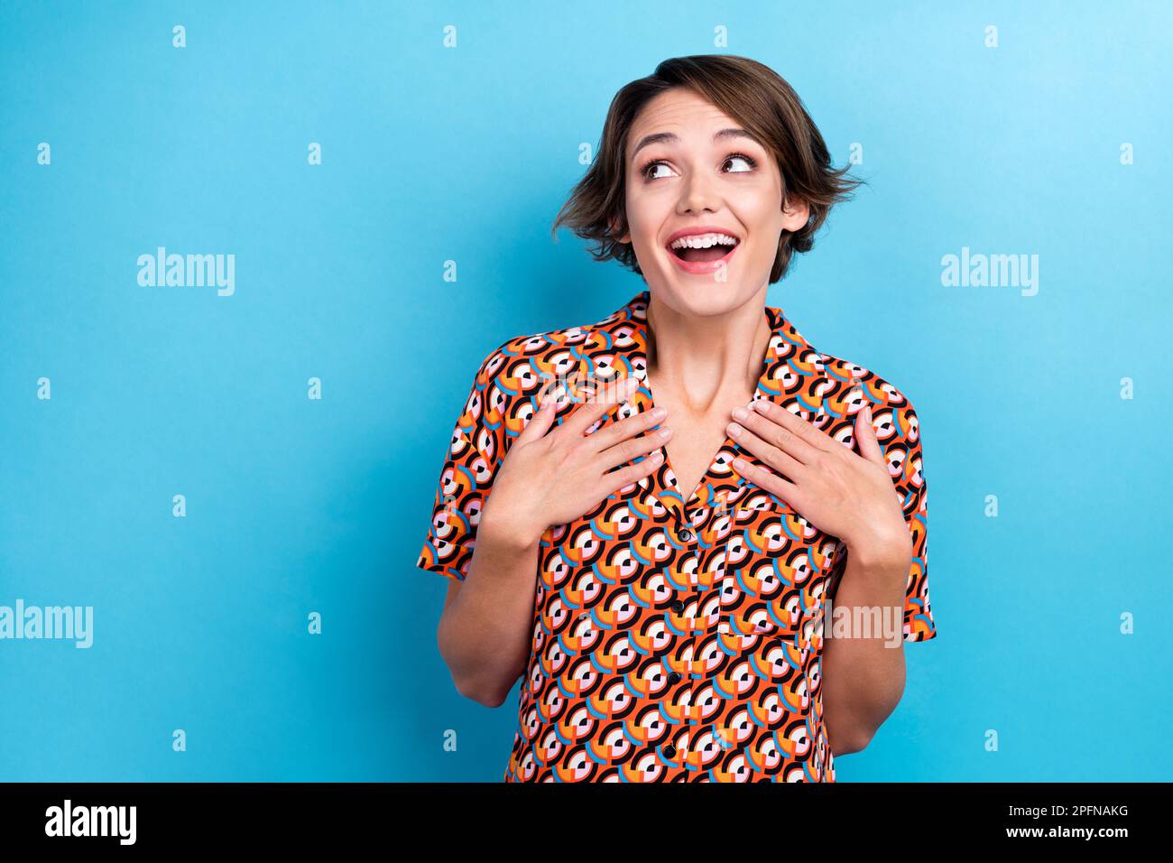 Portrait of positive astonished person hands touch chest open mouth ...