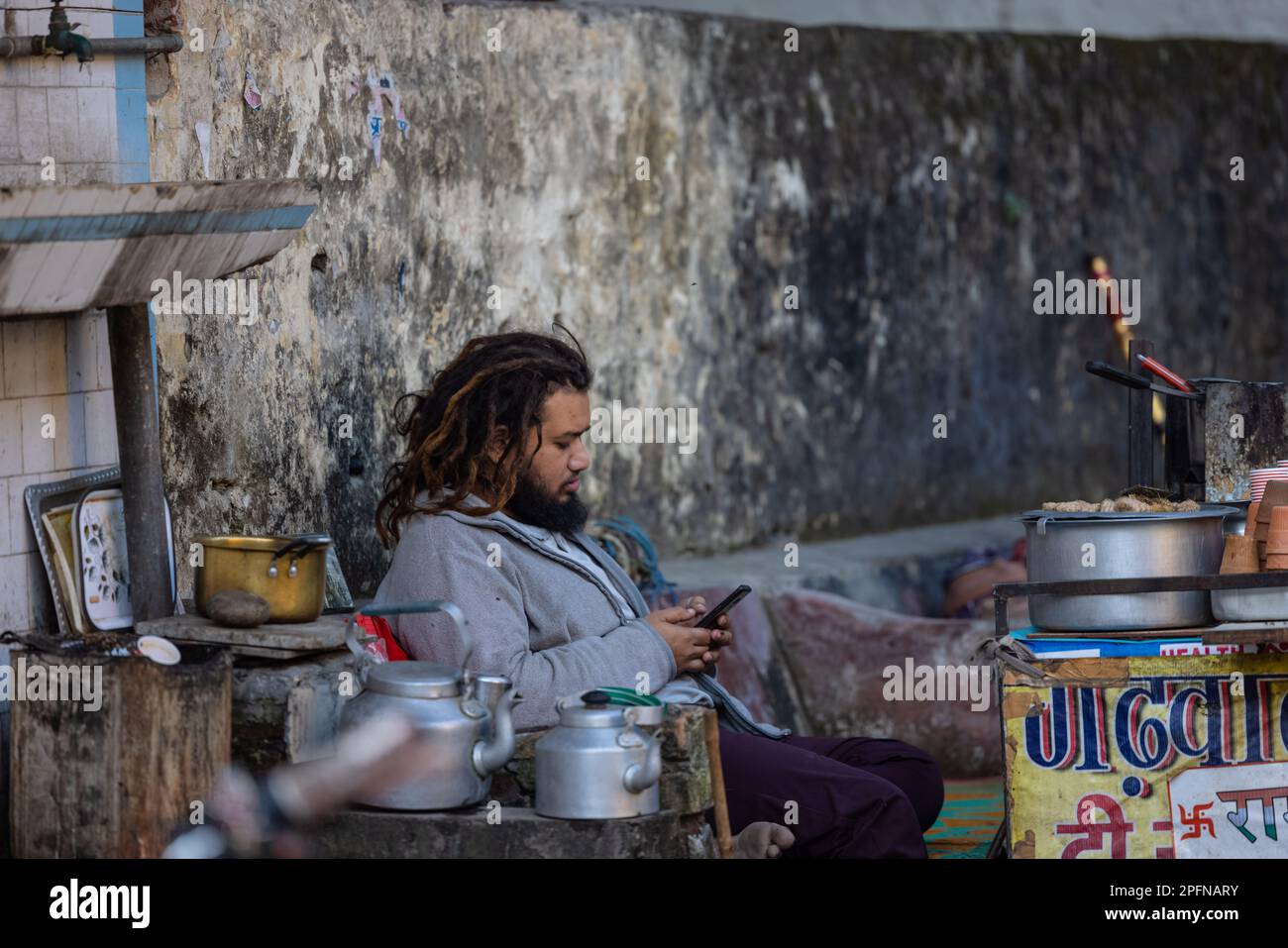 Street tea hawker, Portrait of a tea vendor preparing tea under ...