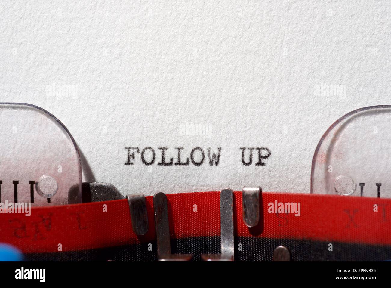 Follow up text written with a typewriter Stock Photo - Alamy