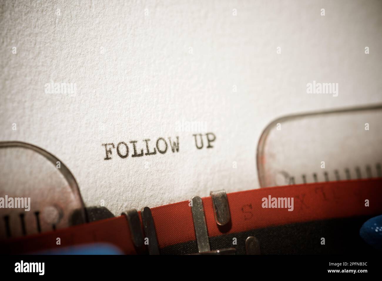 Follow up text written with a typewriter Stock Photo - Alamy